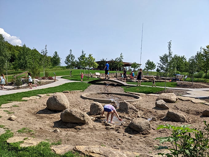 Young archaeologists and future engineers discover the joy of moving sand from one place to another for no particular reason.