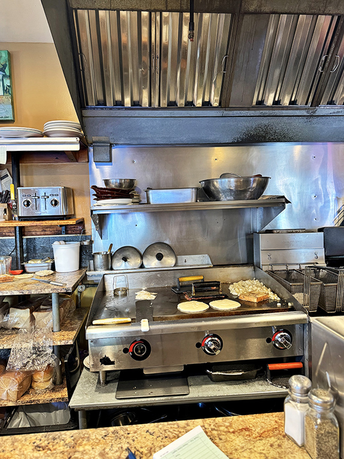 The kitchen &ndash; small but mighty &ndash; where breakfast magic happens on a well-seasoned griddle that holds decades of flavor.