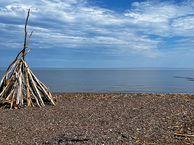 Lake Superior stretches to the horizon like nature's own infinity pool, reminding visitors they're standing at the edge of the world's largest freshwater sea.
