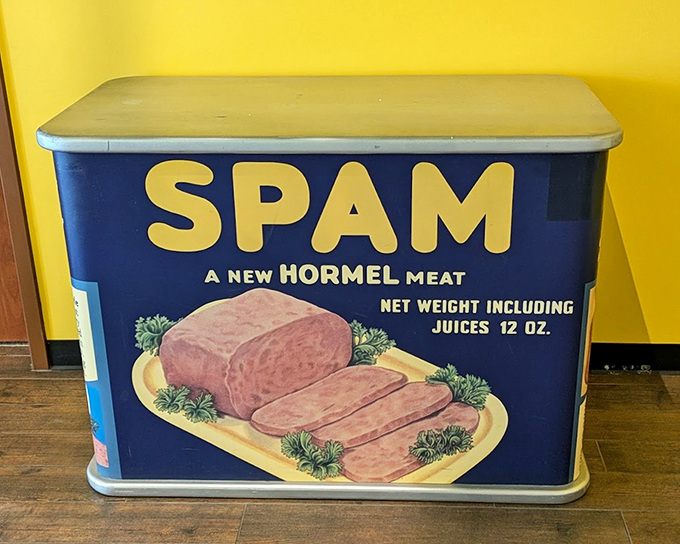 This oversized vintage SPAM tin represents the original 1937 packaging, when a simple blue can launched what would become a global culinary phenomenon.