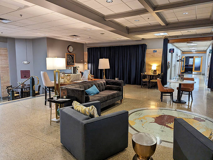 The welcoming lobby lounge provides a comfortable waiting area with subtle nods to the building's aviation heritage.