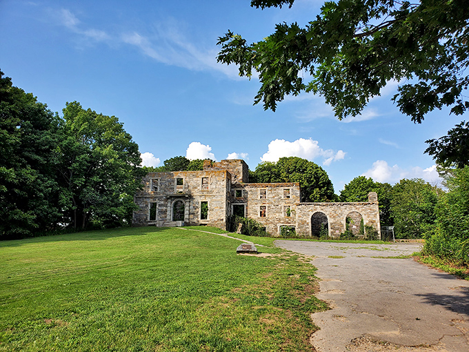Summer's green canvas: Lush grass carpets the grounds where the Goddard family once strolled during Maine's brief, glorious summers.
