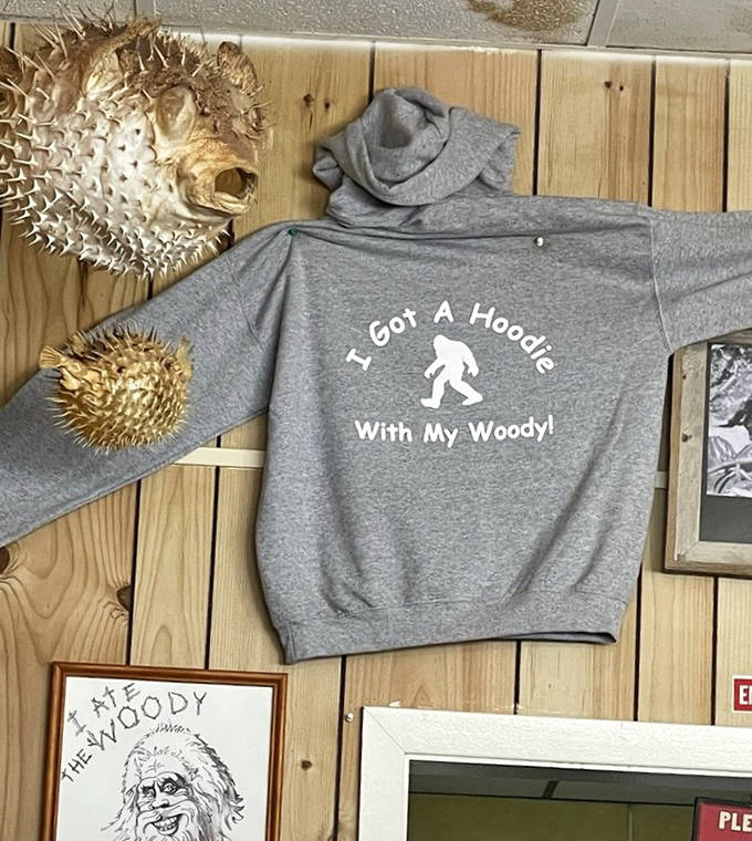 "I Got A Hoodie With My Woody!" proclaims the Bigfoot-themed sweatshirt, capturing the cafe's playful spirit.