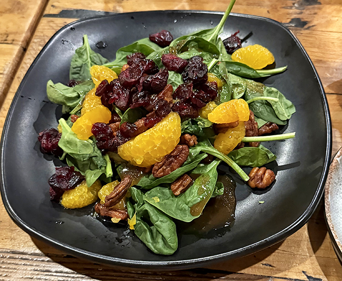A spinach salad that could convert carnivores, bright with oranges and cranberries. Proof that vegetables can be the main event.