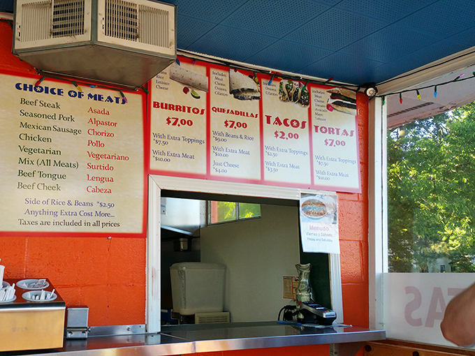The ordering station's handwritten menu boards and bright colors reflect the straightforward, no-nonsense approach that makes this place special.