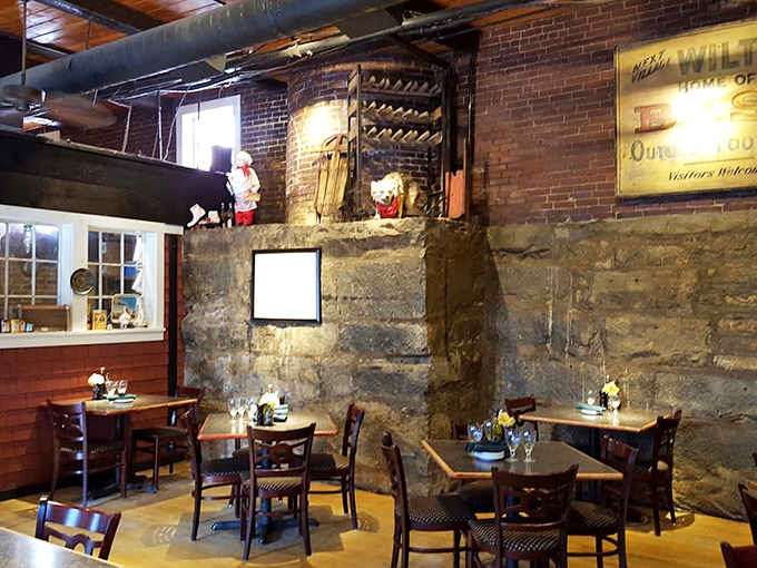 Original stone walls and exposed beams whisper stories of the building's industrial past, creating a dining space with authentic character you simply can't manufacture.