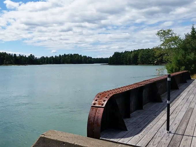 Postcard-perfect views await from the bridge, where the calm waters of Old Pond stretch toward the horizon like a painter's dream.