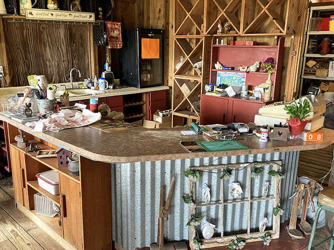 The checkout counter blends farmhouse aesthetics with functionality &ndash; that corrugated metal front adds just the right touch of agricultural authenticity.