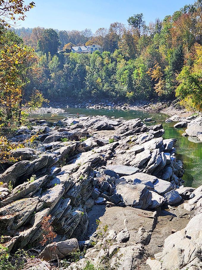 Smooth stones, shaped by centuries of flowing water, create nature's own sculpture garden along the riverbank.