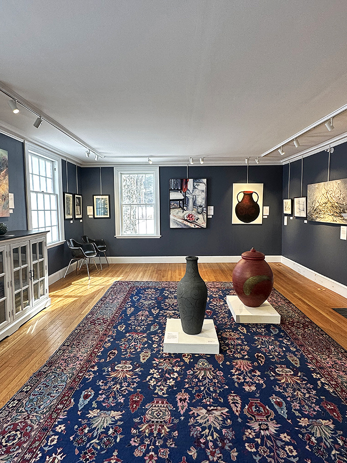 Elegant ceramic vessels command attention in this intimate gallery space, where traditional craftsmanship meets contemporary design sensibilities.