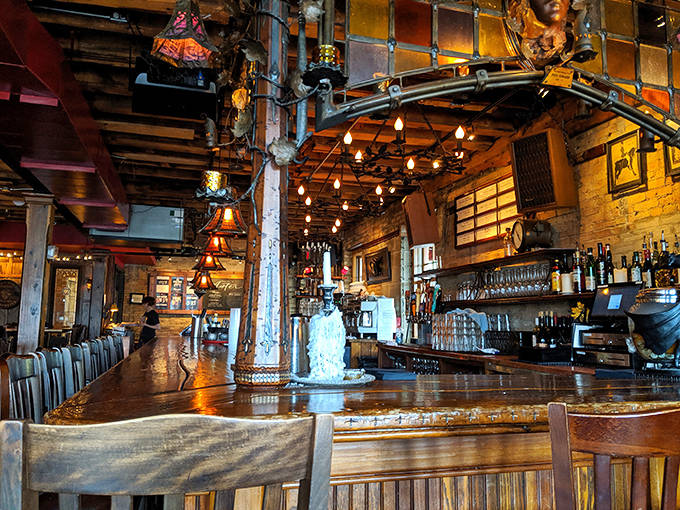 The bar area gleams with amber bottles against exposed brick – a visual symphony that says "pull up a stool and stay awhile."