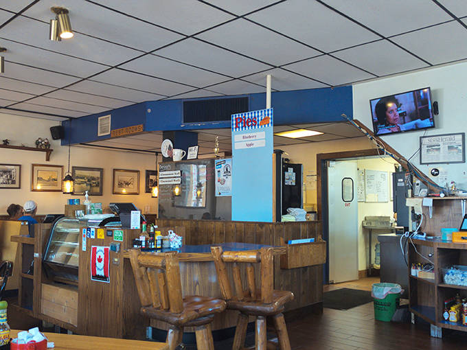 The counter area offers prime real estate for solo diners looking to chat with staff or eavesdrop on locals sharing fishing tips.