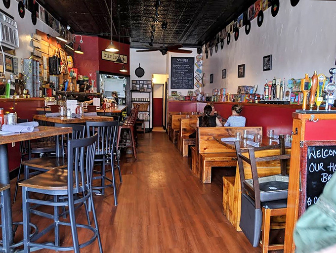 The dining room balances rustic charm with modern comfort &ndash; wooden tables, vintage d&eacute;cor, and the promise of indulgence in every corner.