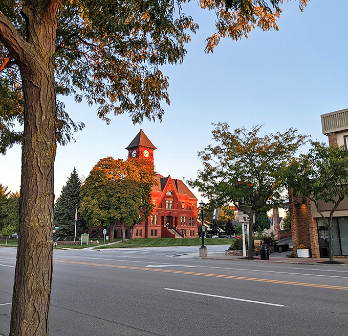 Historic downtown Ludington, glows at sunset as charming architecture, leafy streets, and small-town warmth invite visitors to explore today.