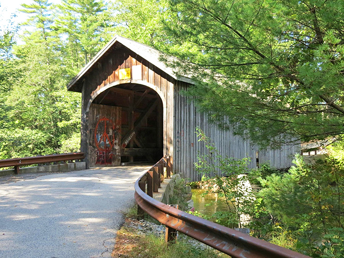 A classic New England covered bridge spanning across a river, showcasing traditional timber construction and rustic charm.