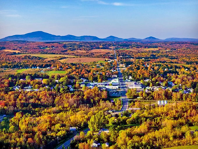 Patten's aerial view reveals a patchwork of forests, fields, and small communities nestled against the backdrop of autumn colors.