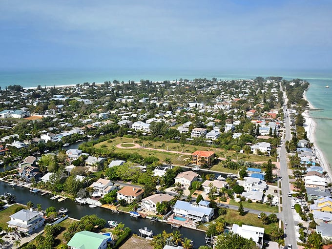 From above, Anna Maria reveals its perfect balance: turquoise Gulf waters on one side, tranquil bay on the other, and in between, a community that fiercely protects its small-town soul.