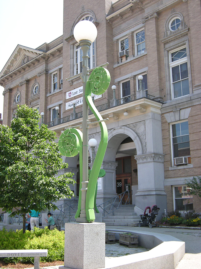 Whimsical green sculpture adds artistic flair outside City Hall, showcasing Montpelier's commitment to public art in unexpected places.