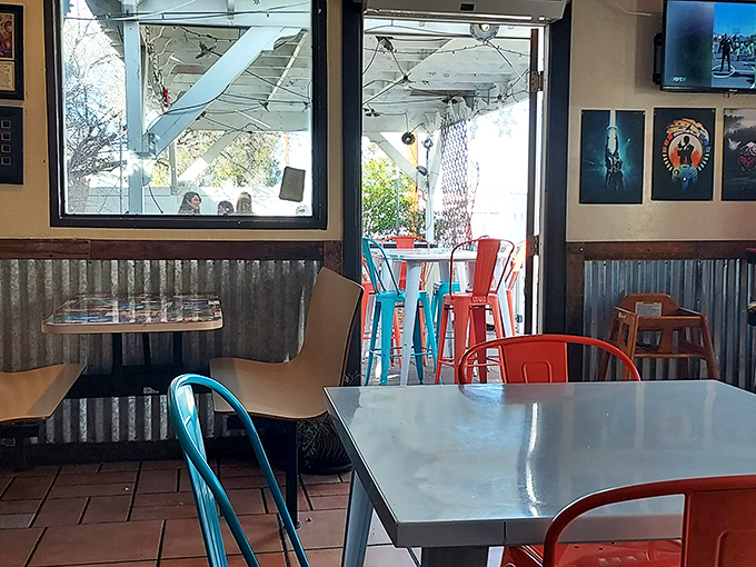 Corrugated metal meets colorful seating in this thoughtfully designed space where comfort meets geek-chic aesthetics.