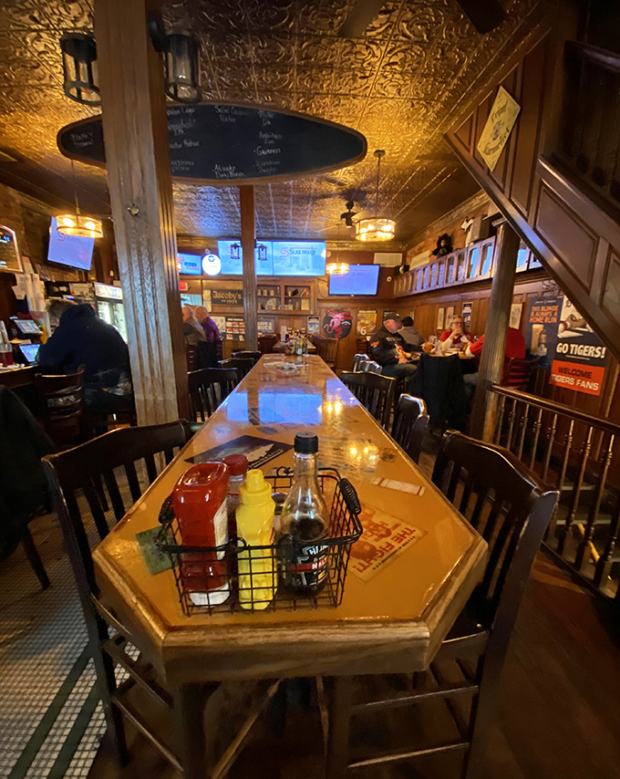 Condiments stand ready for duty at the community table, where strangers become friends over shared mustard and Tigers talk.