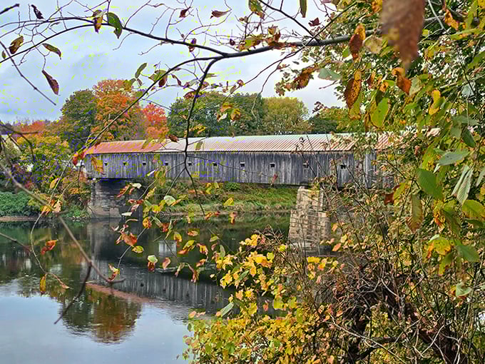 Spring greenery creates a lush frame for this historic structure, highlighting the bridge's perfect harmony with its natural surroundings.