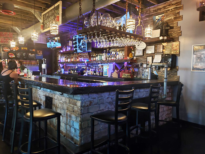 The rustic-industrial bar counter invites patrons to belly up for a pint, with bottles gleaming under atmospheric blue lighting.