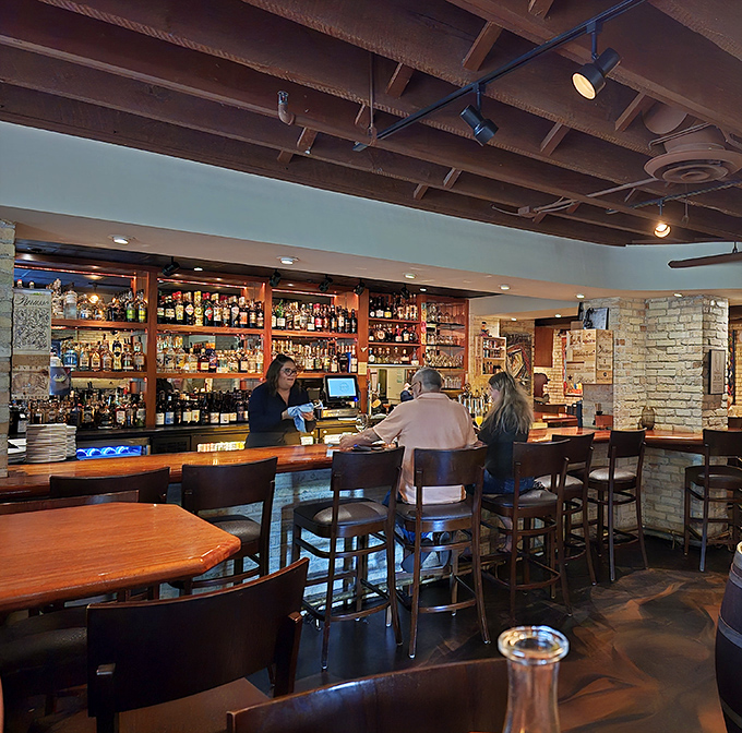 A warm, inviting bar area where strangers become friends and every glass holds a story waiting to be poured and shared.