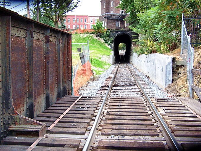 The historic Bellows Falls Tunnel has been guiding trains through solid rock since the 1840s, a marvel of 19th-century engineering still serving modern needs.