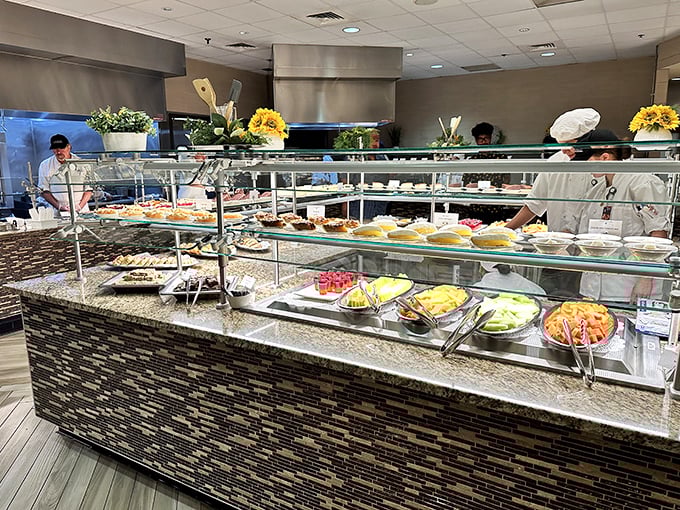 The buffet area gleams with freshly prepared offerings, where chefs stand ready to serve and explain their creations to curious diners.