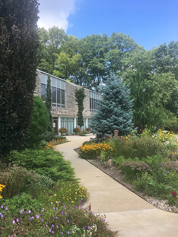 This architectural gem nestles perfectly into its landscaped surroundings, proving that human design and natural beauty can create perfect harmony.