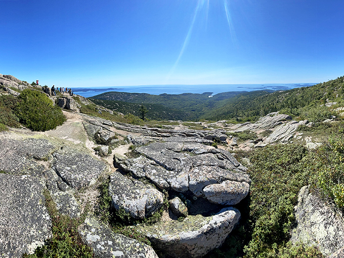 Rocky summit offering panoramic coastal views &ndash; the reward for your climbing efforts couldn't be more spectacular.