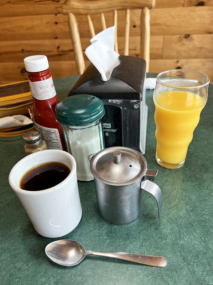 Coffee served in substantial mugs alongside fresh juice &ndash; the perfect liquid companions for your journey through carbohydrate paradise.