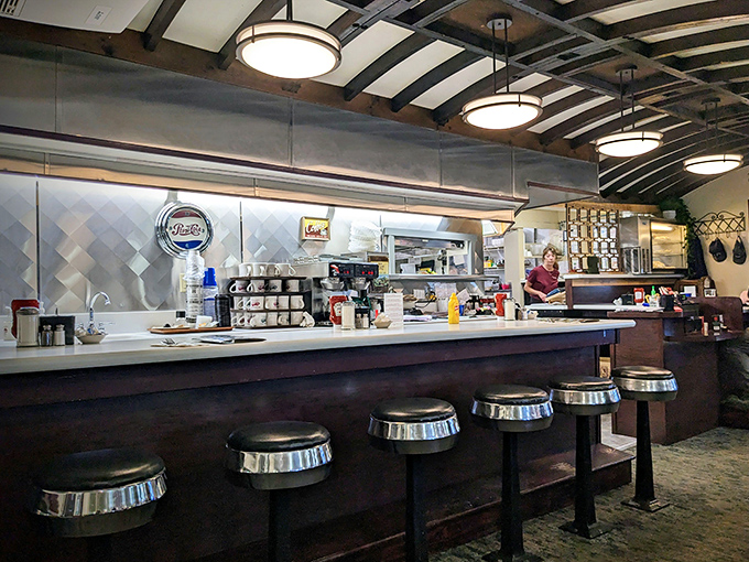 The classic diner counter offers front-row seats to the kitchen action, where you can watch your meal being prepared while contemplating life's important questions.