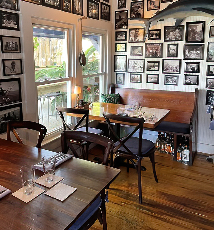 Black and white photos line the walls, telling fishing tales of yesteryear while diners create new memories at polished wooden tables.