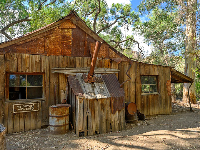 The historic woodshed stands as a testament to pioneer ingenuity, weathered by time yet still full of character.