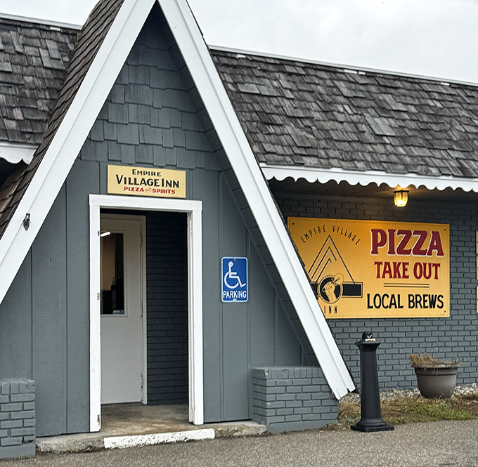 Empire Village Inn's distinctive A-frame architecture promises pizza perfection and local brews in cozy surroundings.