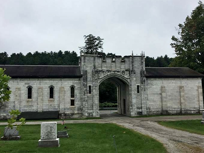 Medieval-inspired stonework creates a dramatic threshold between worlds—both architectural masterpiece and symbolic passage.