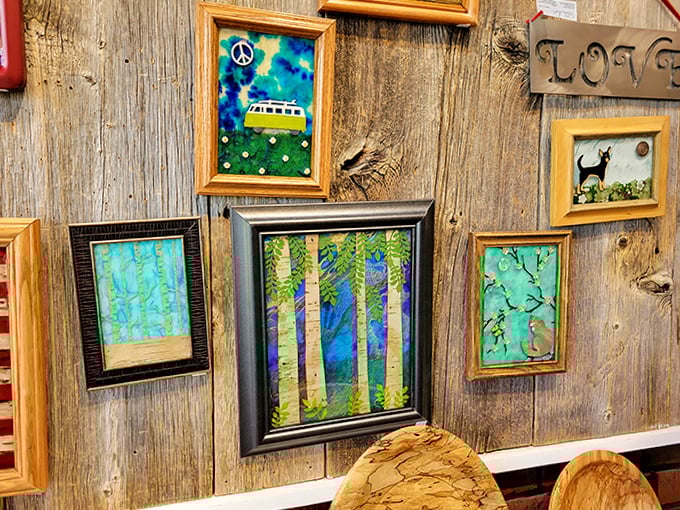Vibrant artwork featuring Vermont's natural beauty brings a pop of color to the rustic barn walls.