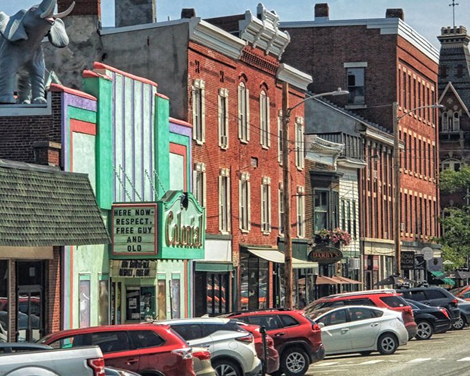 The Colonial Theatre's mint-green facade stands as a beloved landmark and cultural hub since 1912.