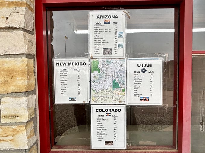 Information displays help visitors understand the distances to major cities in each of the four intersecting states.