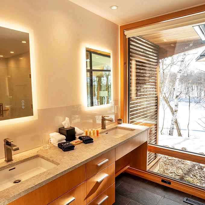 Even the bathroom gets the window treatment, because apparently someone decided that every room deserves a view worth Instagram-ing.
