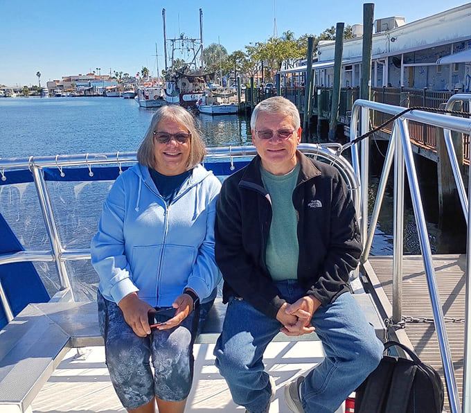 Excited passengers ready to disembark for shelling, their anticipation palpable as they prepare to hunt for those legendary giant shells.