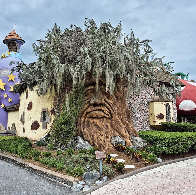 Old Elmer, the talking tree, watches over the village with a weathered face full of wisdom and stories to share.