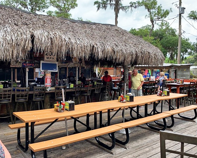 Picnic tables under thatched roofs create the perfect setting for that "I discovered this place" photo you'll definitely be posting later.