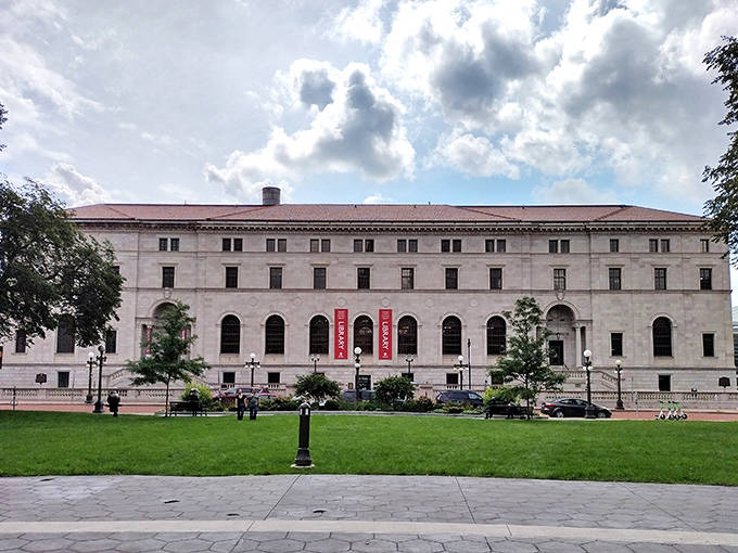 Lush green lawn contrasts beautifully with the stone fa&ccedil;ade, creating an inviting approach to this temple of knowledge.