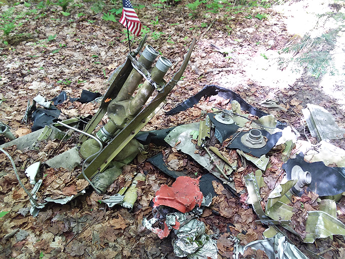 Scattered debris tells the story of the violent impact that forever changed this peaceful mountainside.