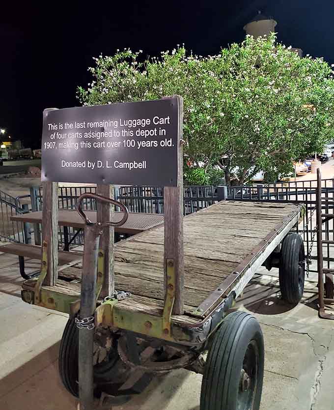 That century-old luggage cart tells stories of travelers past, when journeys required steamer trunks and patience.