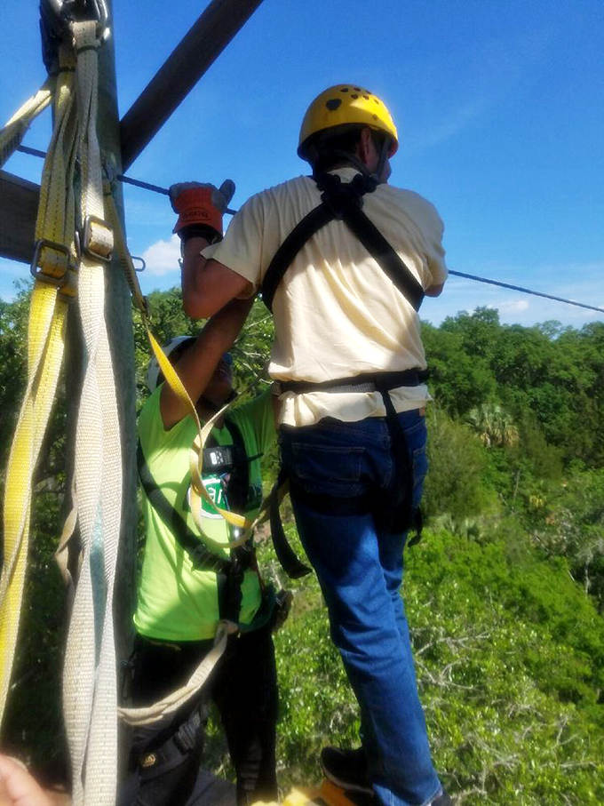 Safety first! Experienced guides ensure every harness is secure before sending adventurers flying across the canyon's expanse.