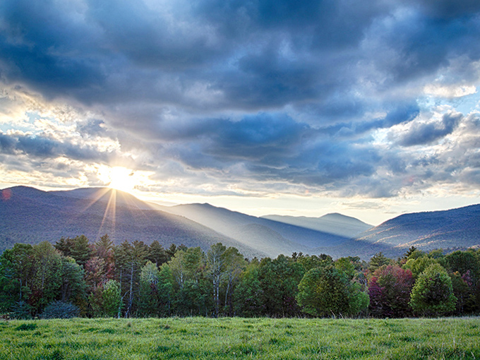 God's light breaks through the clouds, casting divine rays across valleys that have inspired generations of visitors to pause and simply breathe.
