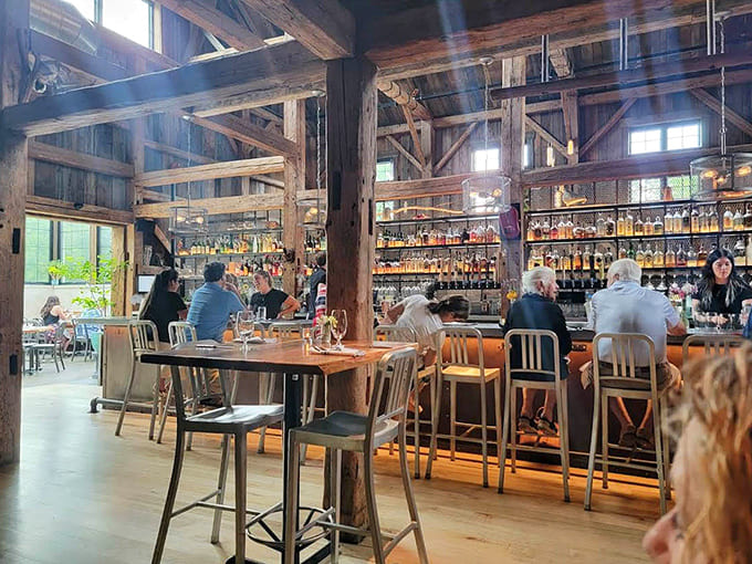 Diners enjoying their meals in a space where exposed beams and modern design elements create the perfect backdrop for memorable evenings.